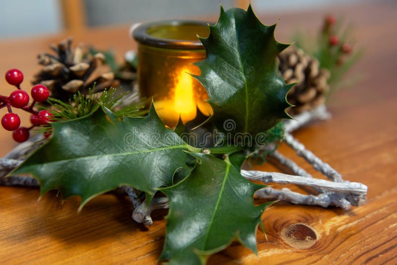 Christmas Table Decorations with Holly and a Mini Light Stock Image ...