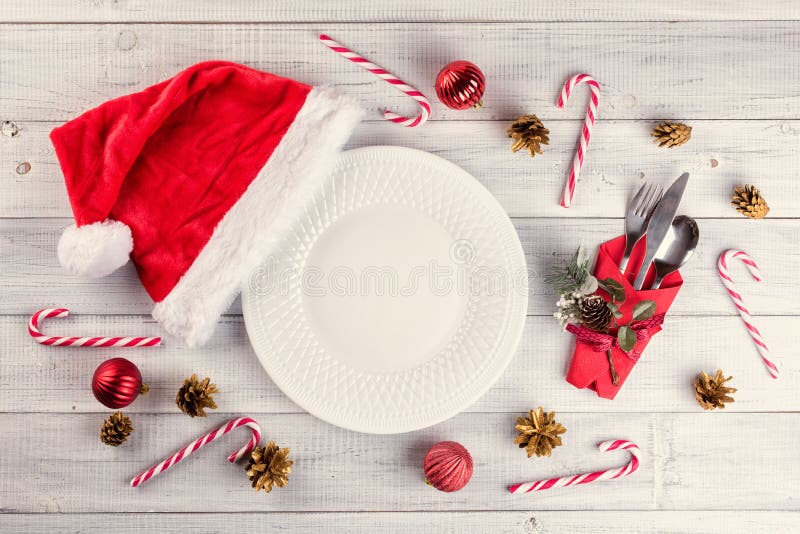 Christmas Table Setting with an Empty Plate and Red Santa Hat Stock ...