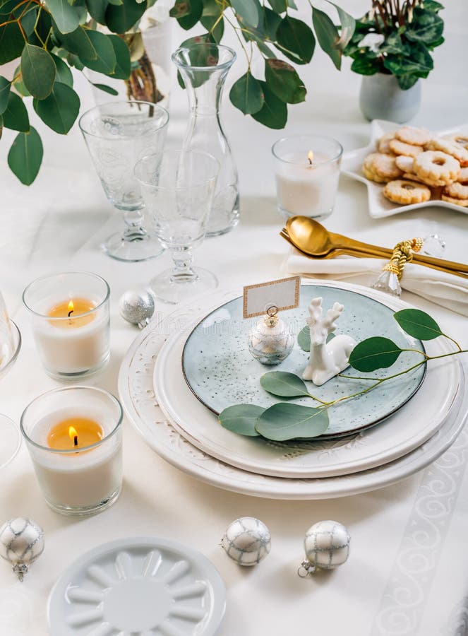 Christmas Table Setting with Eucalyptus, Cutlery and Candles in White ...