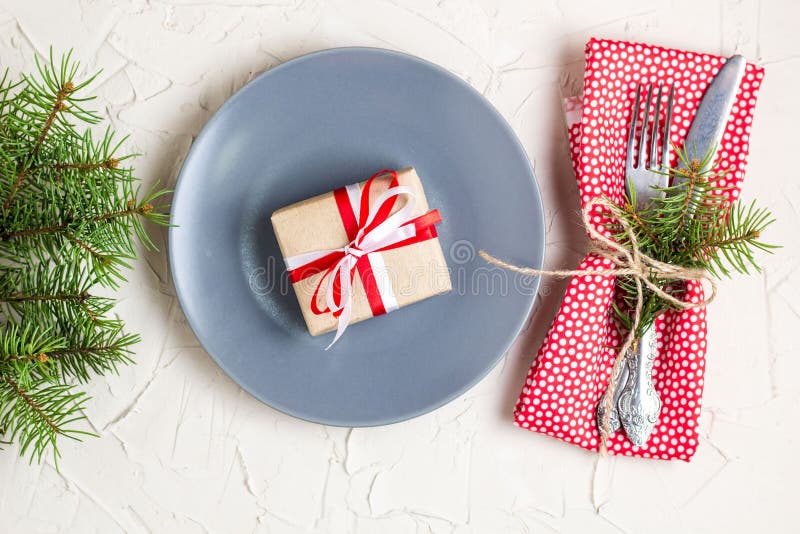 Christmas Table Setting with Gift on Plate on White Table. Xmas Concept ...