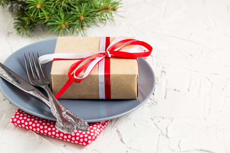 Christmas Table Setting with Gift on Plate on White Table. Xmas Concept ...