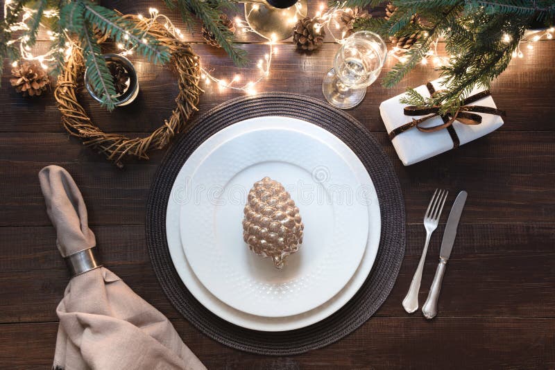 Christmas Table Setting with Silverware, Garland and Dark Decor. Top ...