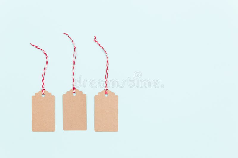 Christmas Tags in Plain Cardboard with Red String and White String on ...