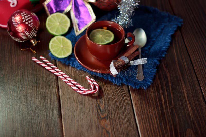 Christmas Tea on Wooden Table with Lime and Candy Canes Stock Image ...