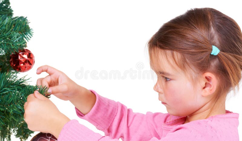 Christmas Time...a Little Girl Decorating the Christmas Tree. Stock ...