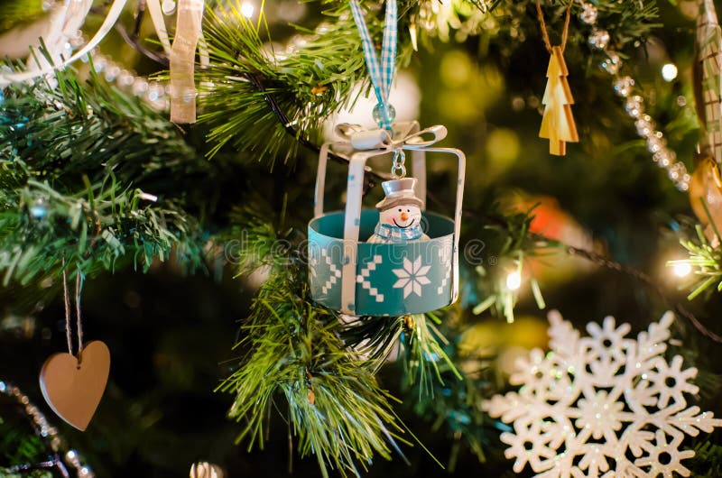 Christmas Toy Snowman Hanging on a Decorated Christmas Tree. Stock ...