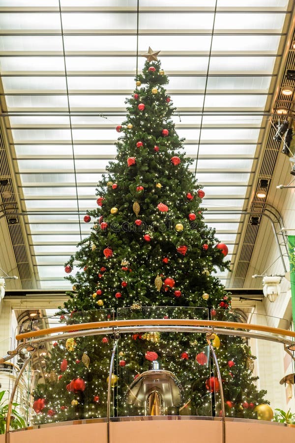 Christmas Tree on Balcony Under Lights Stock Image - Image of shiny ...