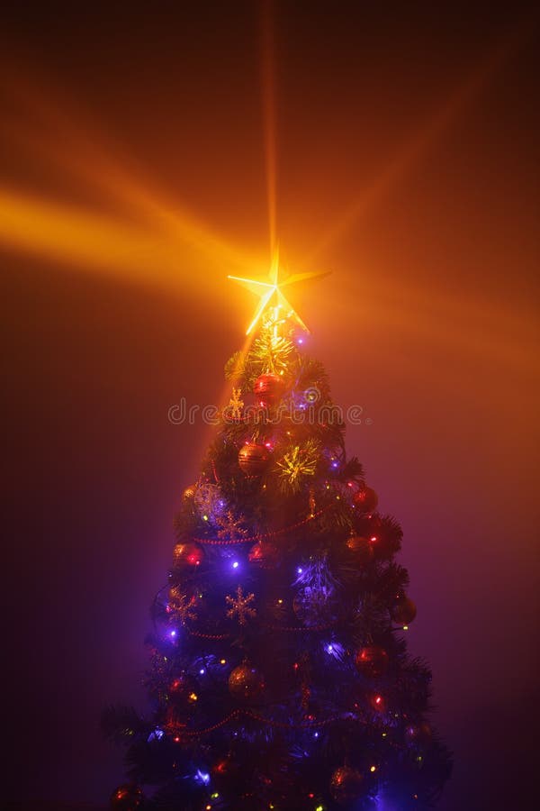 Christmas Tree with Festive Lights, Orange Background with Smoke Stock ...