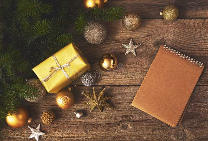 Christmas Tree with Gift Box, Decorations and Notebook Over Wood Stock ...