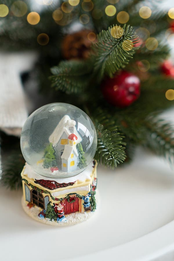 Christmas Tree in Glass Ball on Snow. Glitter Lights Stock Image ...