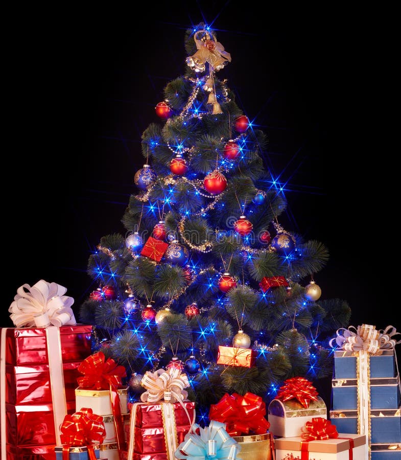 Brightly Lit Christmas Tree with Lots of Gifts Stock Photo - Image of ...