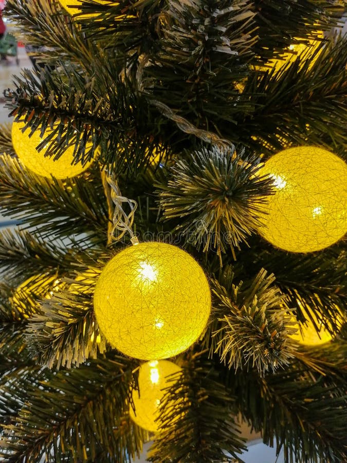 Christmas Tree with Large Yellow Balls Fragment Stock Image - Image of ...