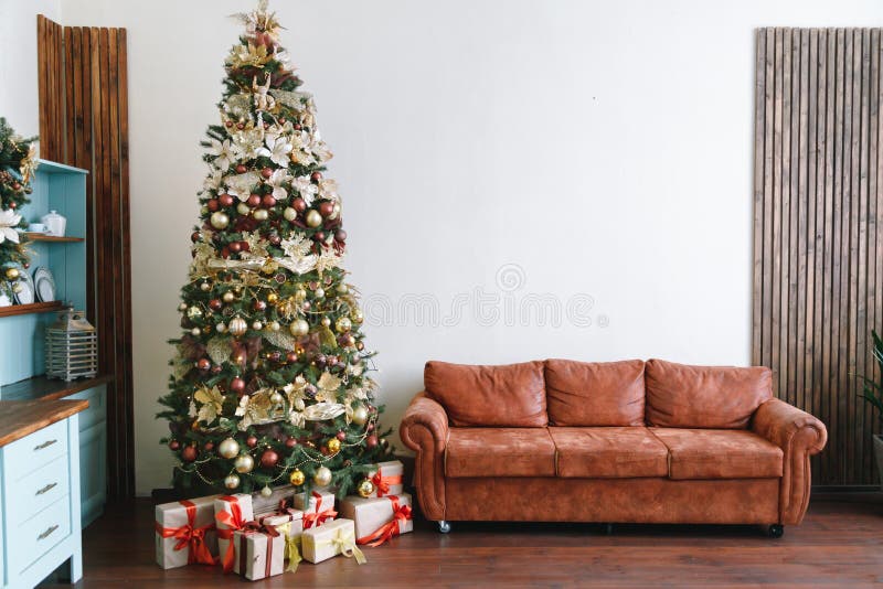 Christmas Tree with Leather Sofa in a White Room Stock Photo - Image of ...