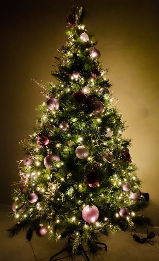 Christmas Tree Lit Up and with Pink Decorations Stock Photo - Image of ...