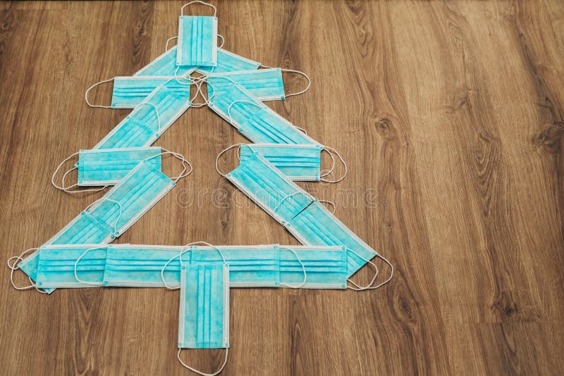 Christmas Tree Made of Blue Medical Masks on a Brown Background Stock ...