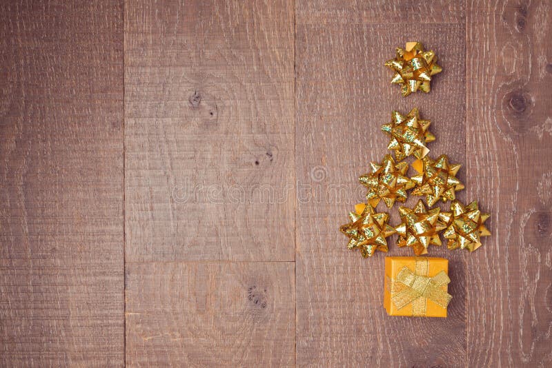 Christmas Tree Made from Decorative Bows and Gift Boxes on Wooden ...