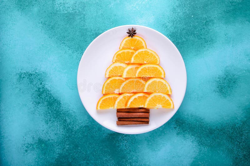 Christmas Tree Made of Orange Slices on a Green Background Stock Photo ...