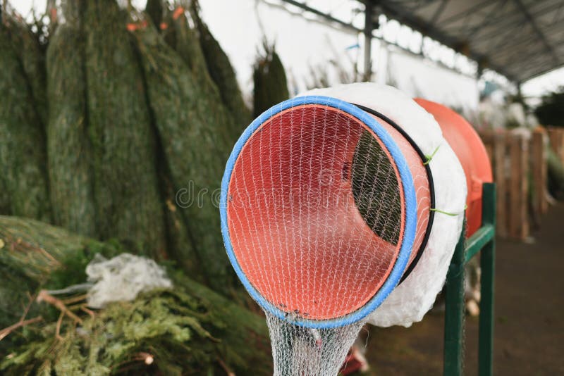 Red Christmas Tree Wrapping Device Packed in a Plastic Net Stock Photo ...