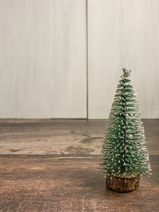 Christmas Tree Miniature on Wood Table for Holiday Concept Stock Photo ...