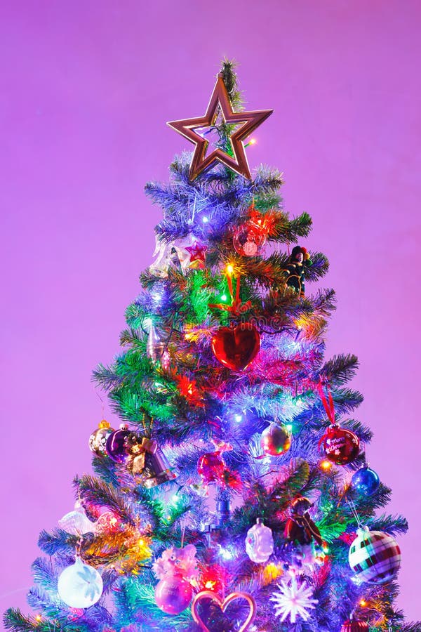 Christmas Tree with Multicolor Led Lights and Purple Background Stock ...