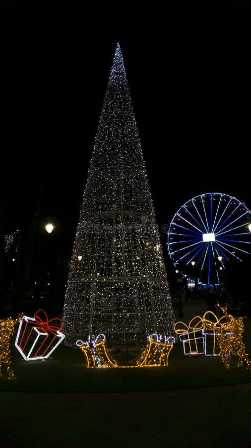 Christmas Tree with Presents and Christmas Ferris Wheel Stock Photo ...