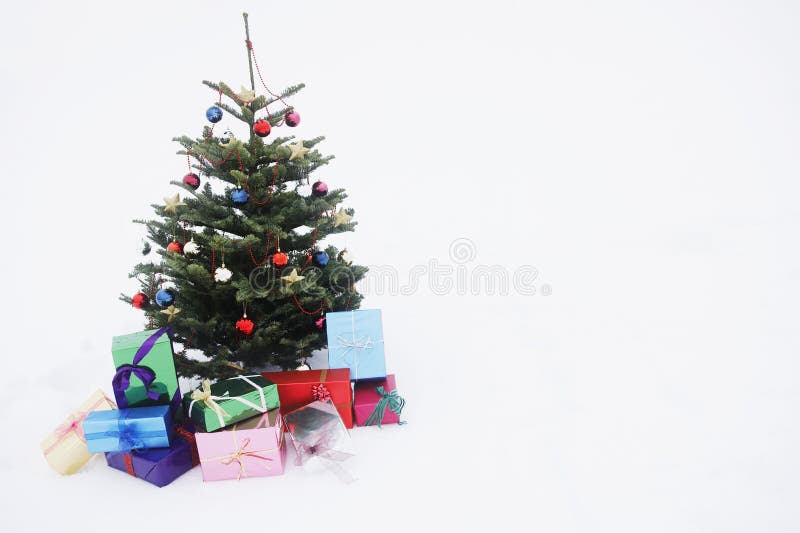 Christmas Tree with Presents in Snow Stock Photo - Image of tree, view ...