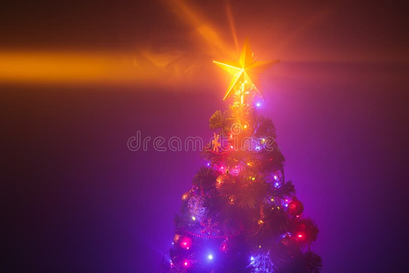 Christmas Tree with Shining Star and Dense Smoke Stock Photo - Image of ...