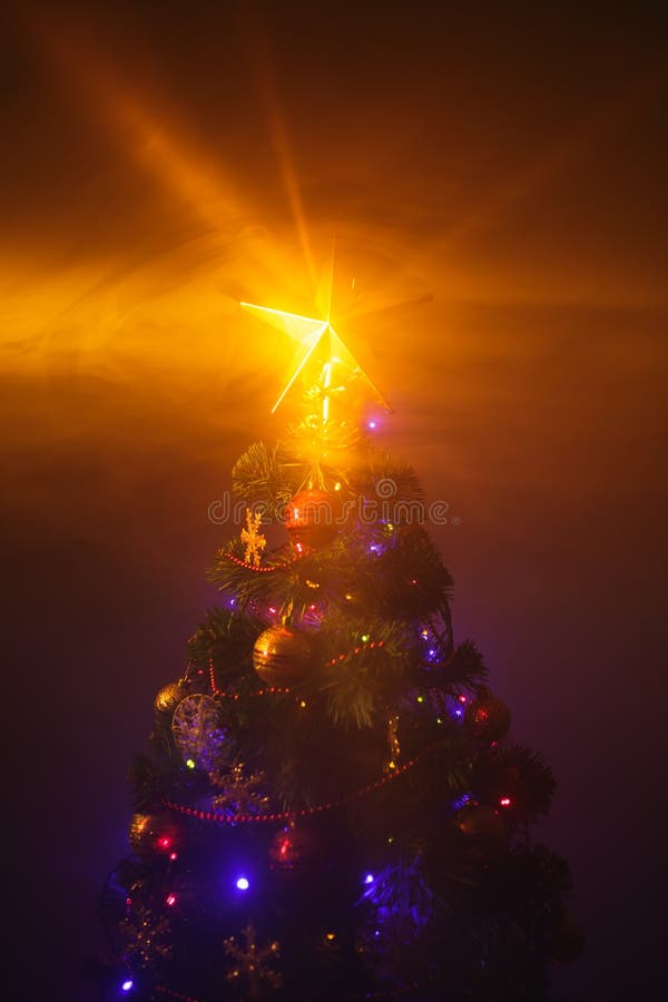 Christmas Tree with Shining Star and Dense Smoke Stock Photo - Image of ...