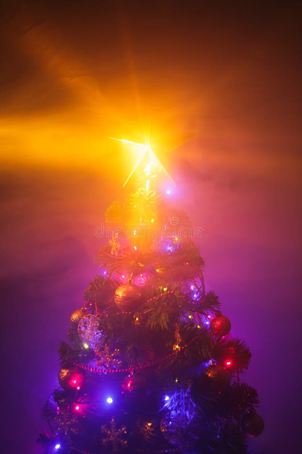 Christmas Tree with Shining Star and Smoke Stock Photo - Image of pine ...