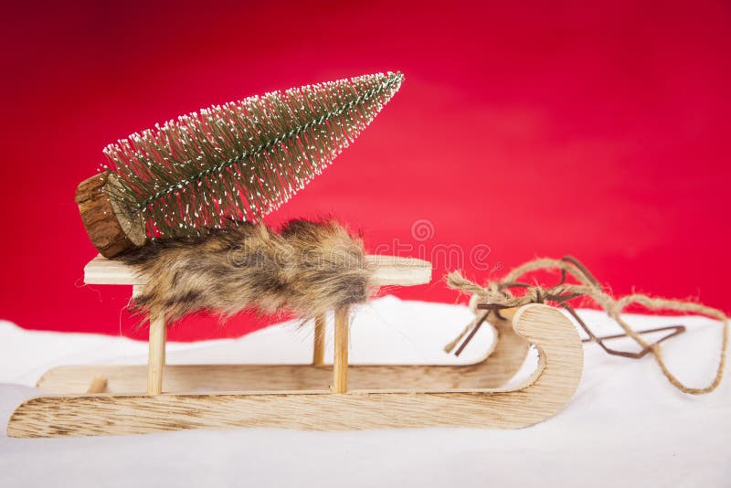 Christmas Tree on a Sled, Snow and Red Background, Side View Stock ...