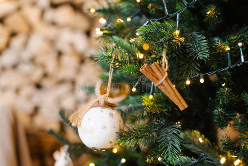 Christmas Tree with a White Ball Toy and Cinnamon Stick Hanging from it ...