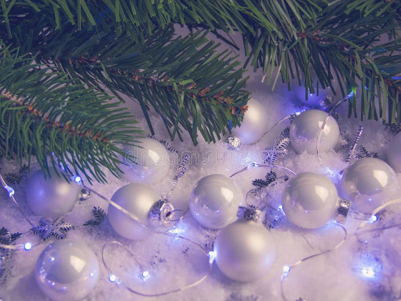 Christmas White Balls with a Garland Under the Tree Stock Photo - Image ...