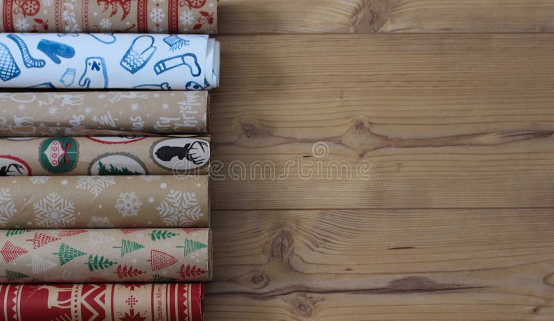 Christmas Wrapping Paper Rolls on Wooden Ground Stock Image - Image of ...