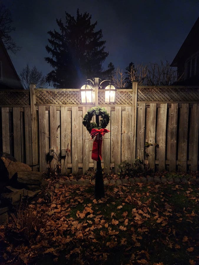 Christmas Writh and Lamp Post Stock Photo - Image of reflection, lamp ...