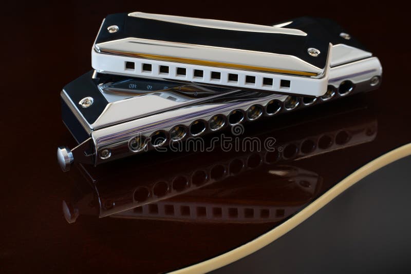 Chromatic and Diatonic Harmonica Stack on Back of Acoustic Guitar Stock ...