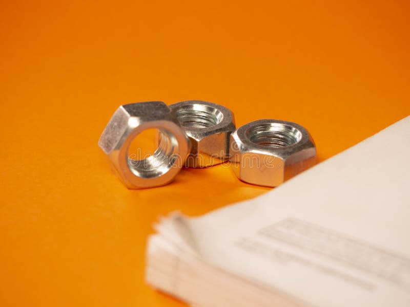 Chrome-plated Metal Nuts on Blue Background. Technology Concept Stock ...