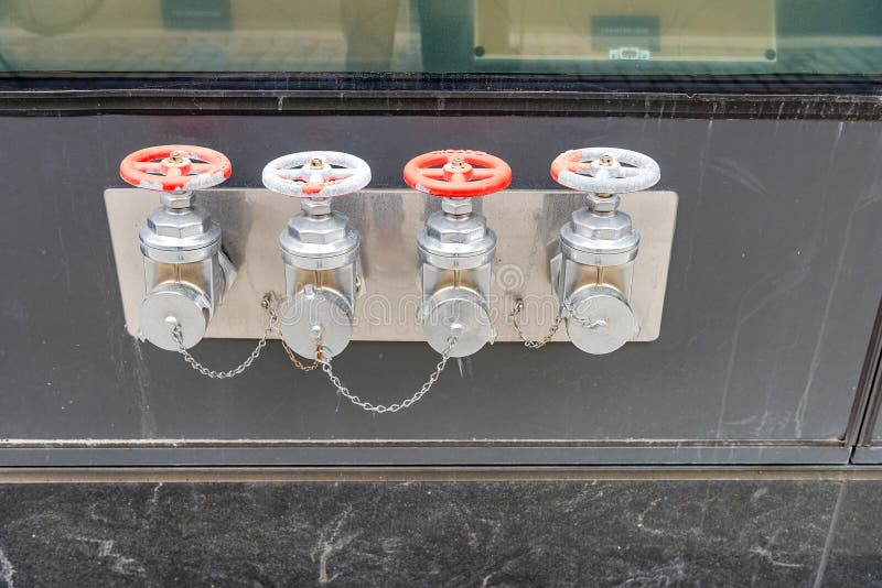 Chrome Plated Multifunctional Fire Hydrant in the Wall of the Building ...