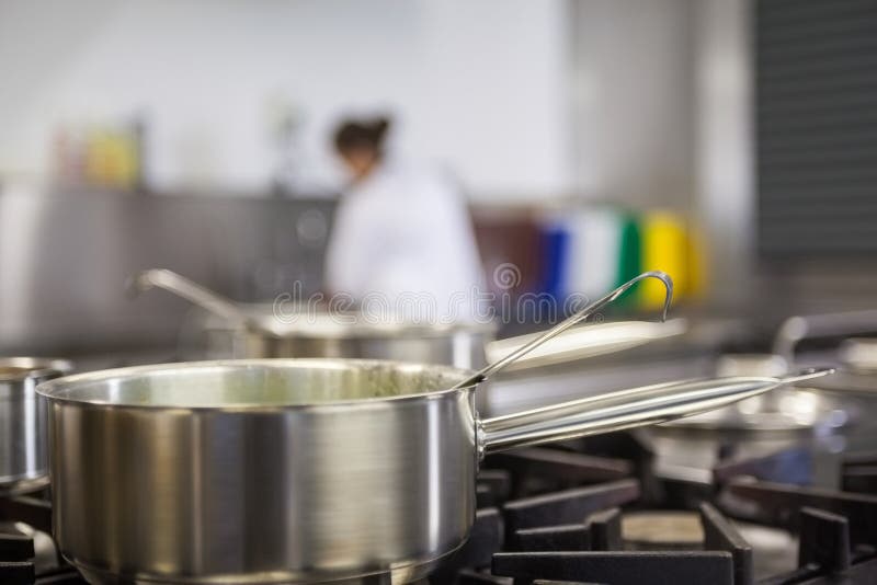 Chrome Pot Cooking on Hotplates Stock Image - Image of person, hotplate ...