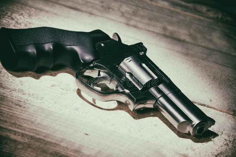 Chrome Revolver on a Wooden Table Stock Image - Image of murder, black ...