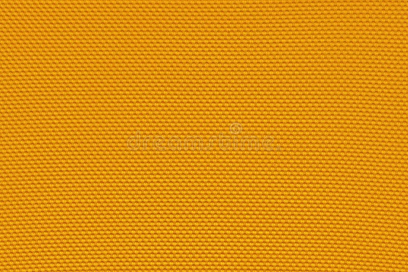 Chrome Yellow Background from a Textile Material with Pattern, Closeup ...