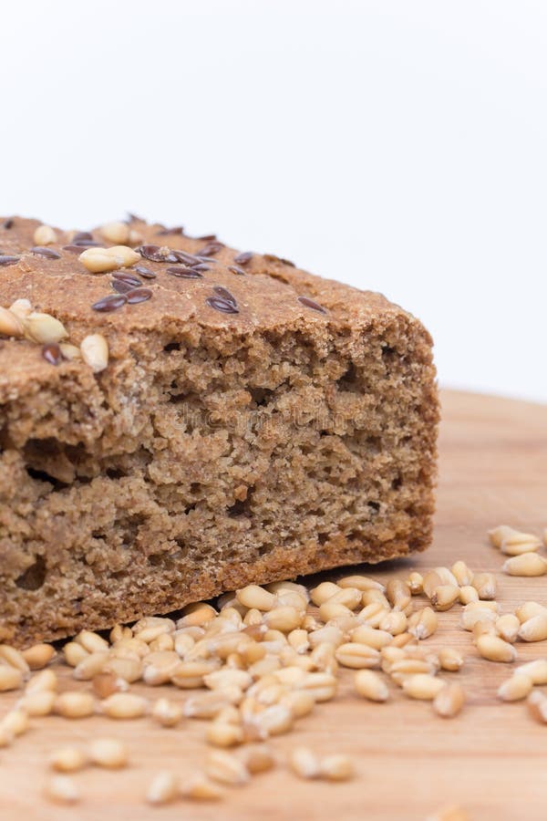 Chrono Bread on a Wooden Board with Grains of Wheat Stock Photo - Image ...