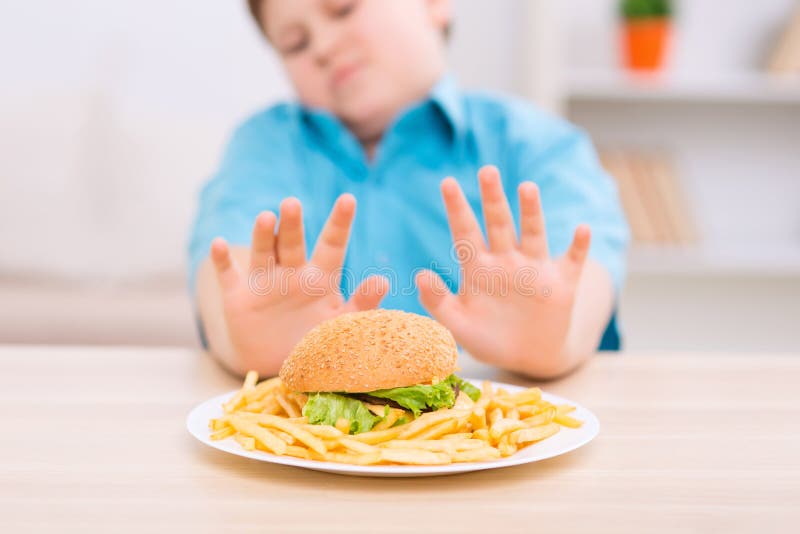 Chubby Kid Refuses To Eat Unhealthy Food Stock Photo - Image of closeup ...