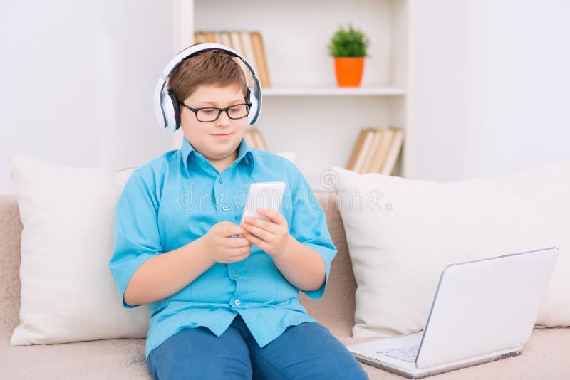 Chubby Kid is Using Smartphone Stock Photo - Image of indoors ...