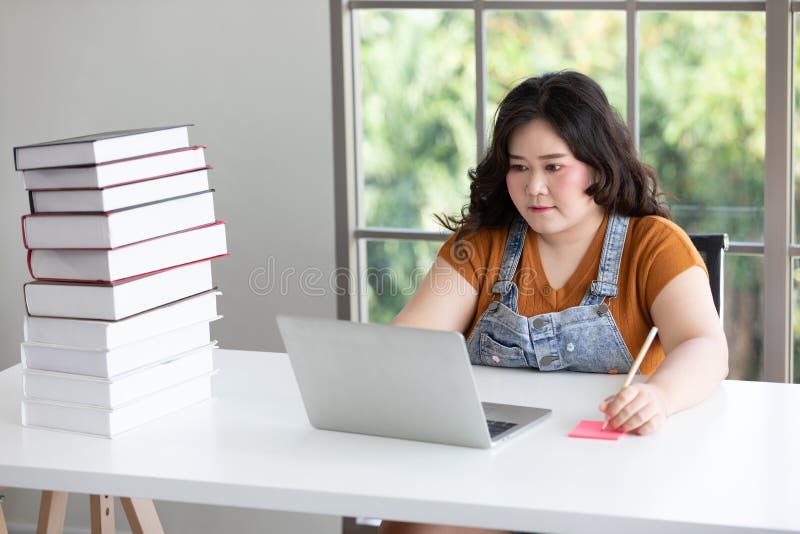 Chubby Woman Works from Home and Studying with Computer Laptop Stock ...