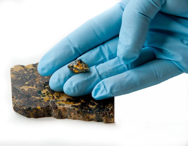 Chunk of Uraninite in Gloved Fingers Stock Photo - Image of radioactive ...