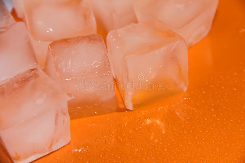 Chunks of Ice on an Orange Background. Ice on a Bright Background Stock ...