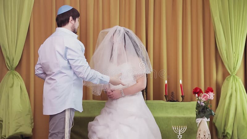 During the Chuppah Ceremony, the Jewish Bride and Groom in the ...