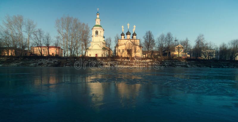 Church on the Banks of the Frozen River Stock Image - Image of frozen ...