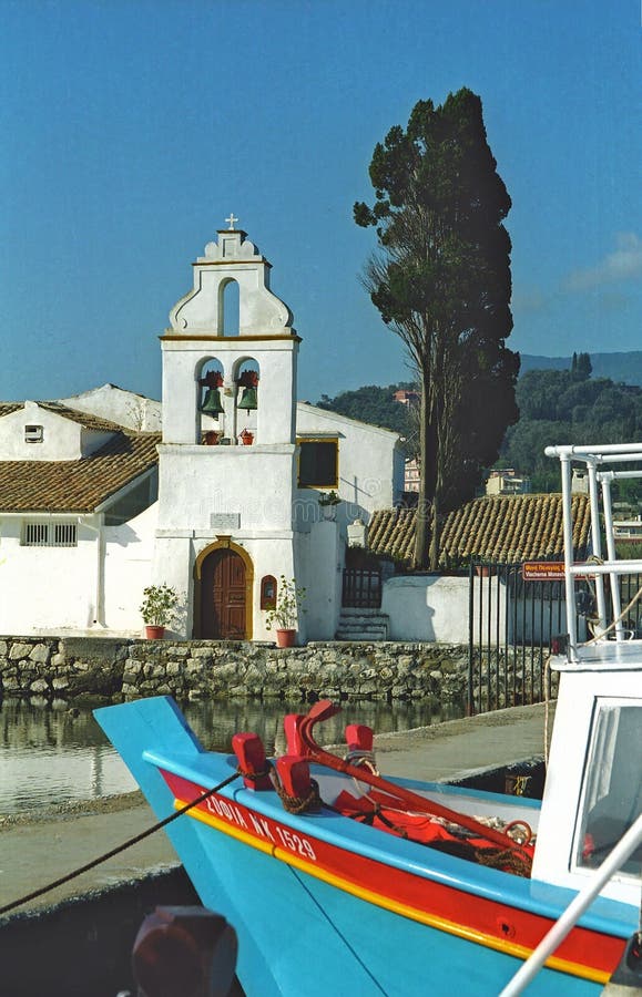 Church and a boat in Corfu stock image. Image of belltower - 5525077