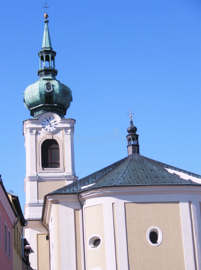A Church Building Taken from a Side Angle with a Mountain Backdrop and ...